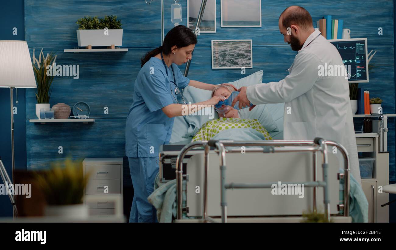 Doctor rushing elderly patient hospital hi-res stock photography and ...