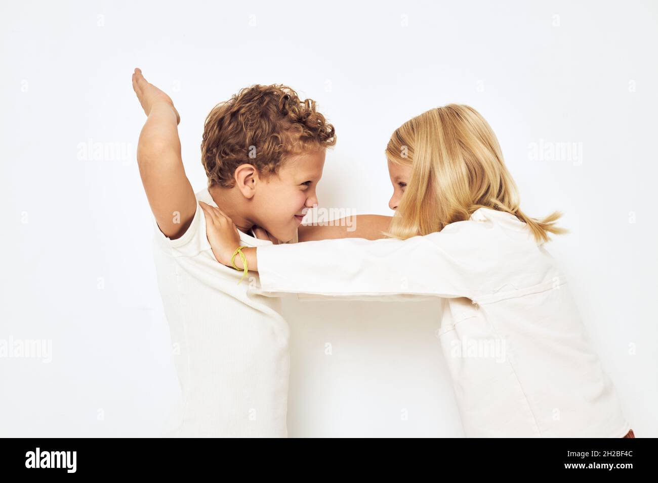 Two children boy and girl quarrel resentment isolated background Stock ...