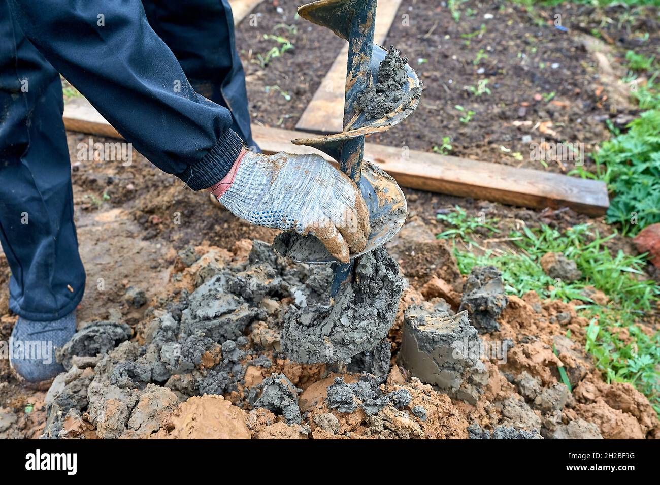 drilling a well under water manually Stock Photo - Alamy