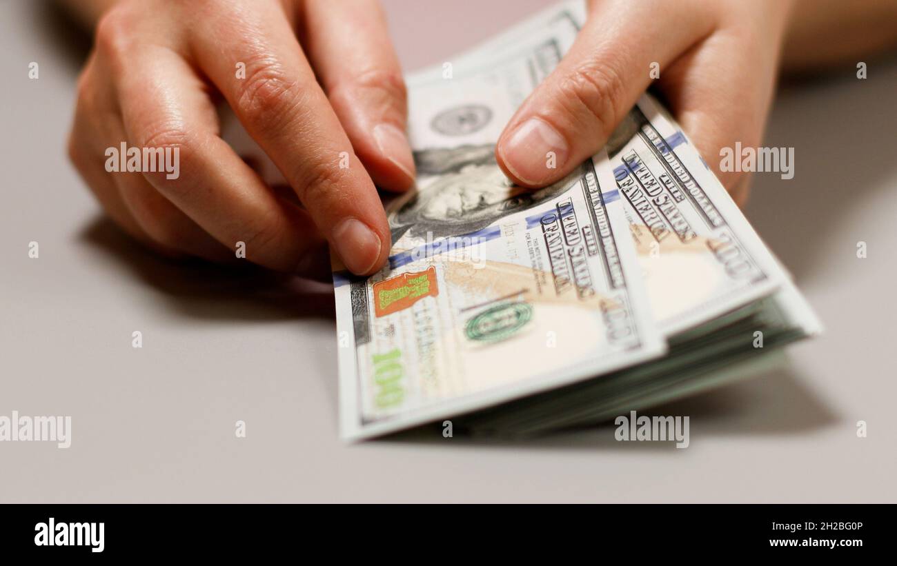 Woman hand count the united states currency. Economy concepts Stock ...