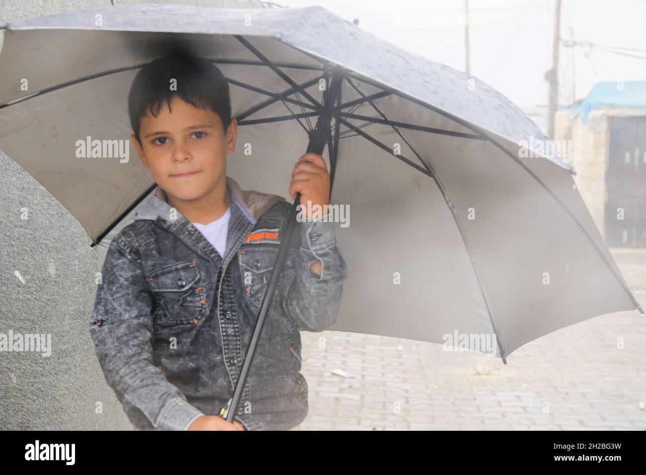 A portrait of a sweet refugee child in the camp. Syrian refugees Stock ...