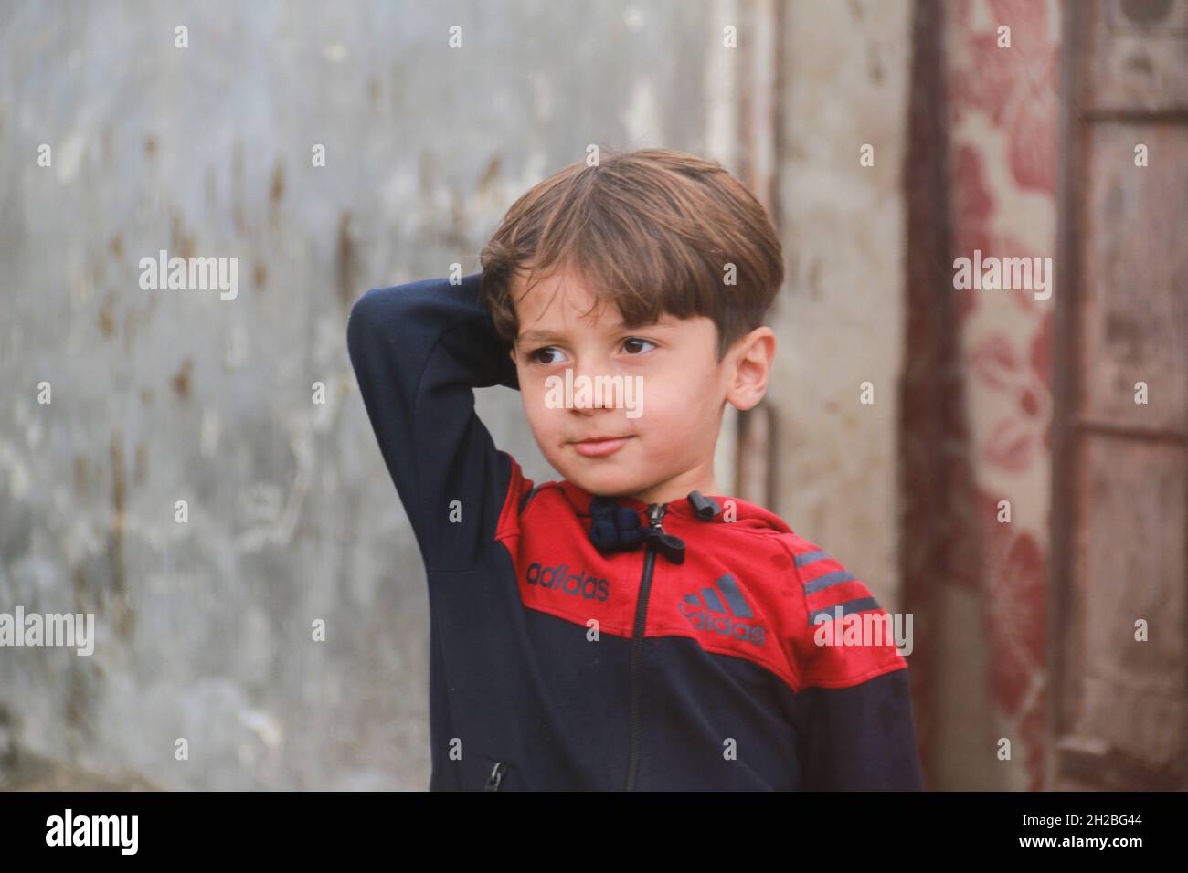 A portrait of a sweet refugee child in the camp. Syrian refugees Stock ...