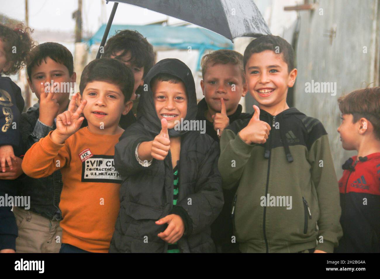 A portrait of a sweet refugee child in the camp. Syrian refugees Stock ...