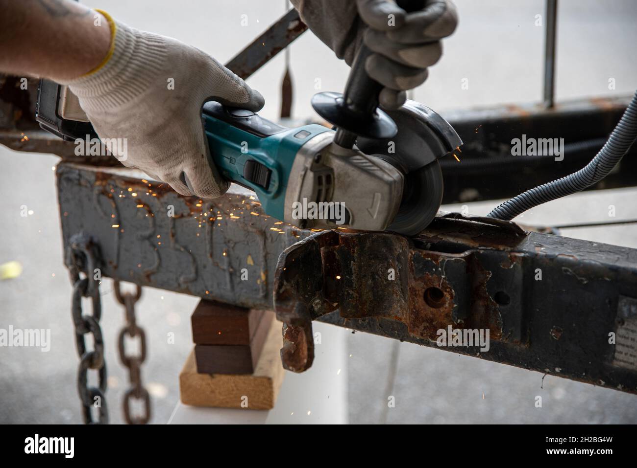 worker using a metal grinder machine Stock Photo - Alamy