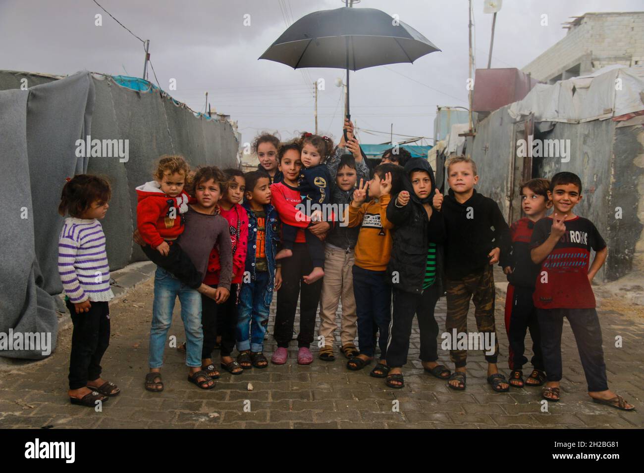 A portrait of a sweet refugee child in the camp. Syrian refugees Stock ...