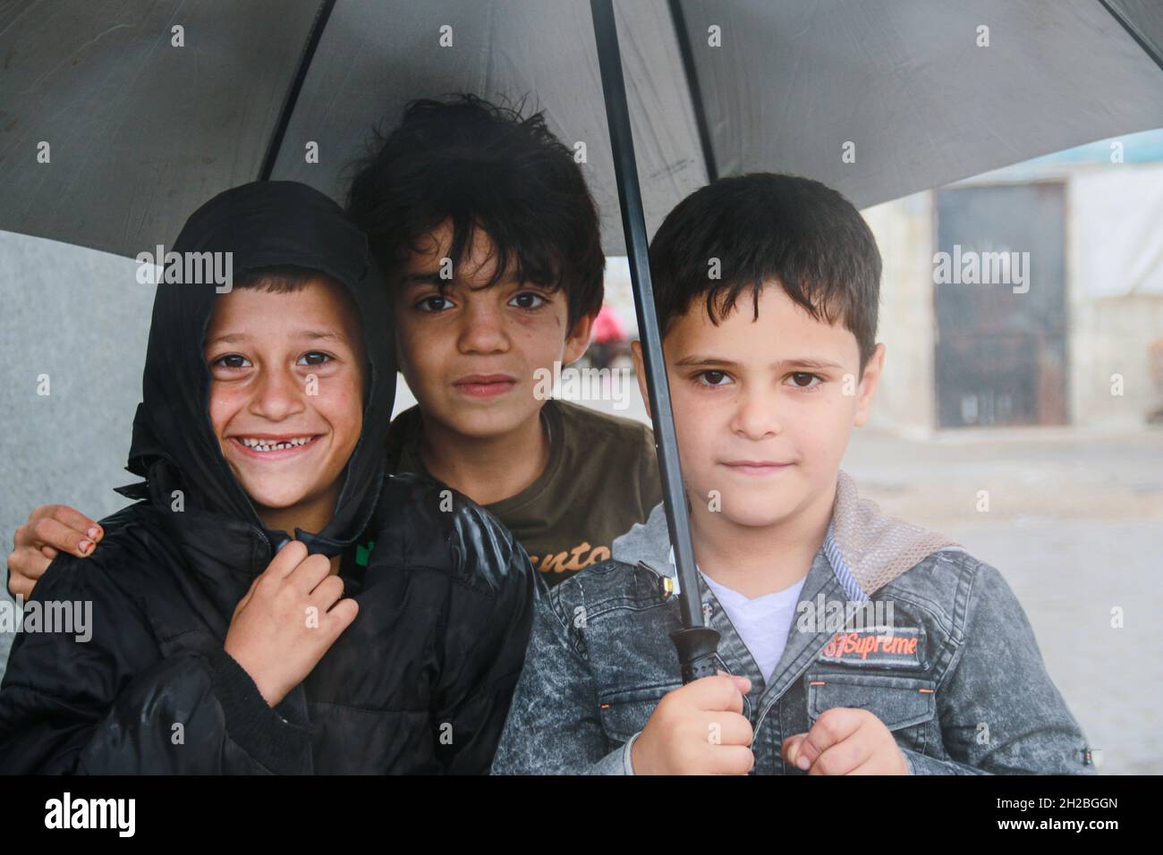 A portrait of a sweet refugee child in the camp. Syrian refugees Stock ...