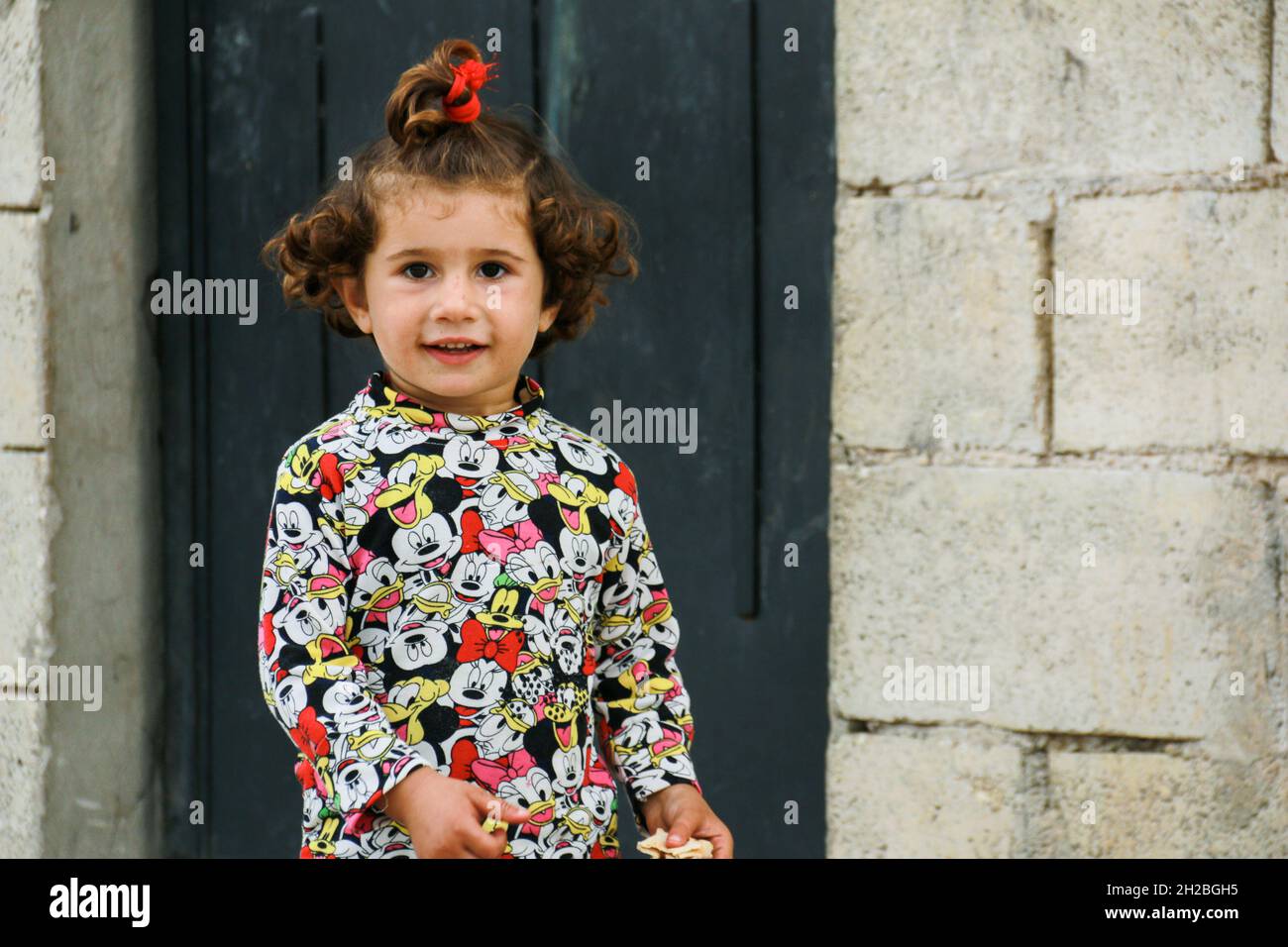 A portrait of a sweet refugee child in the camp. Syrian refugees Stock ...