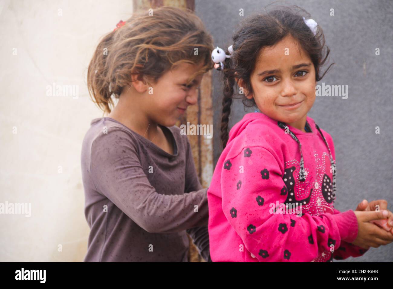 A portrait of a sweet refugee child in the camp. Syrian refugees Stock ...