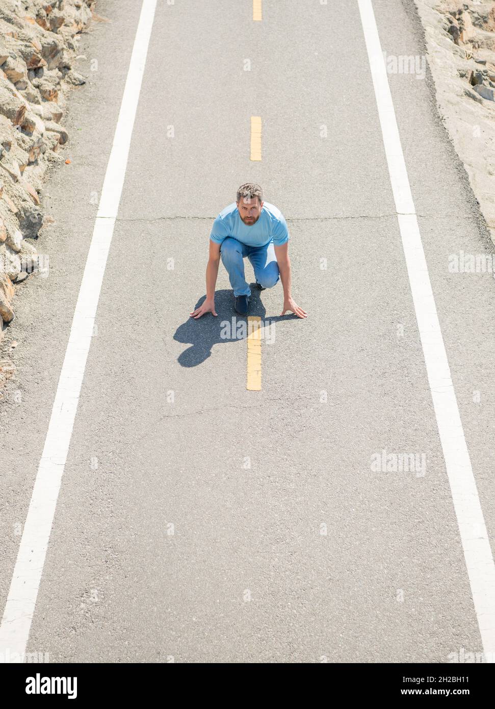 challenge and competition. healthy lifestyle. mature man on road start ...