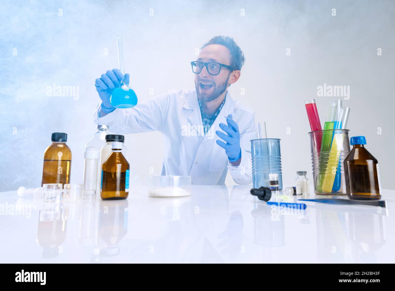 One young scientist, chemist or doctor conducts chemical research at ...