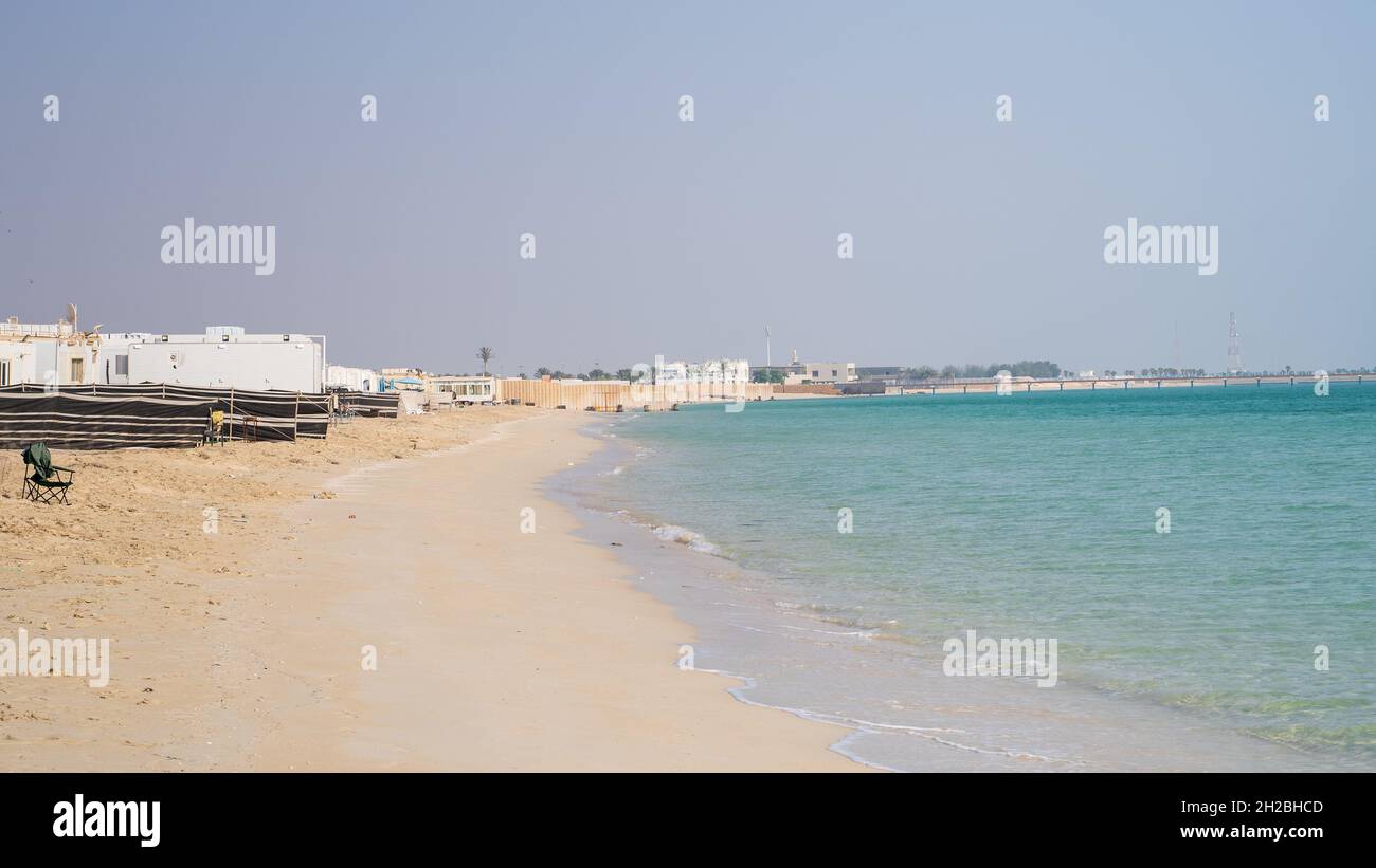 Multiple tents in the Qatar Fuwairit beach setup for camping during the ...
