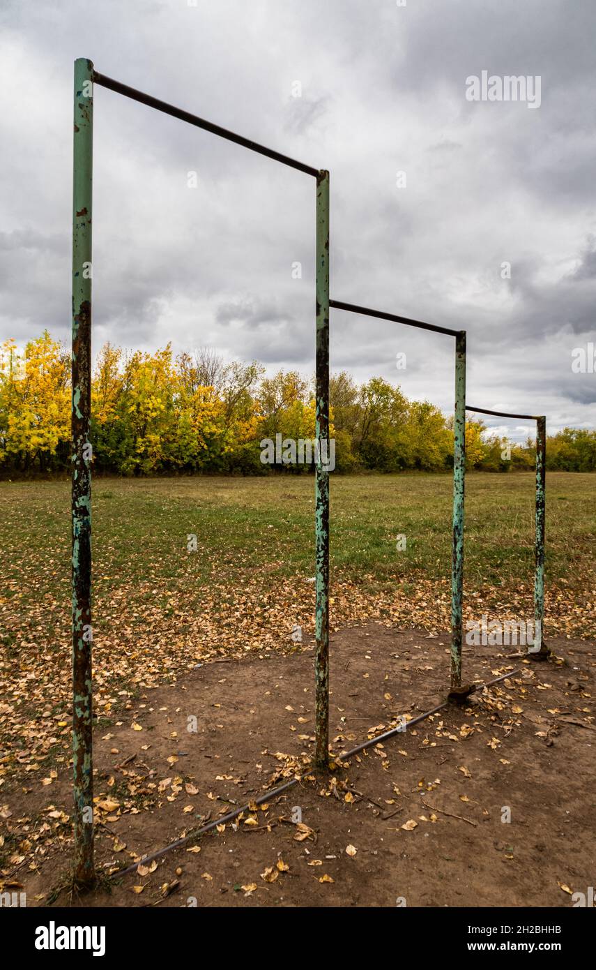 old metal horizontal bar on a rustic playground. High quality photo ...