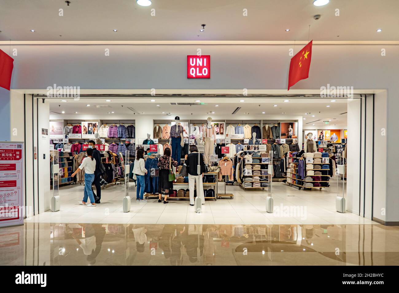 ZHENGZHOU, CHINA - Sep 28, 2021: The UNIQLO front store with logo and ...