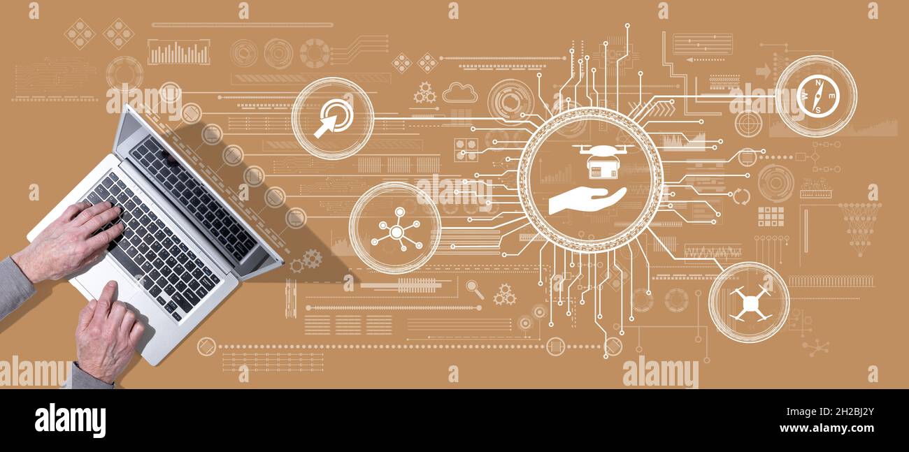 Top view of hands using laptop with symbol of drone delivery concept ...