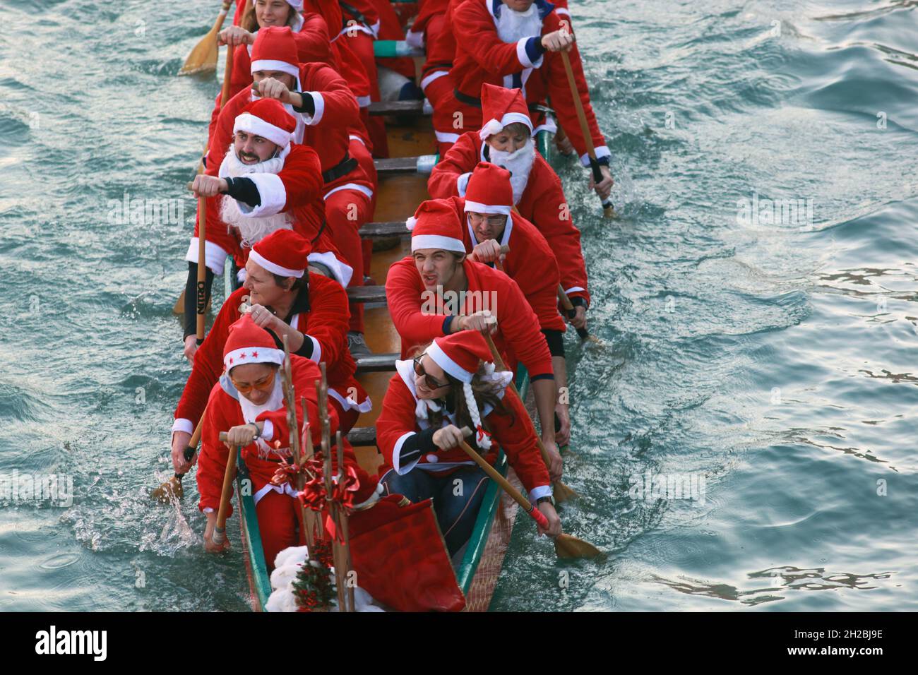 People dressed as Santa Claus row during a Christmas regatta in Venice ...