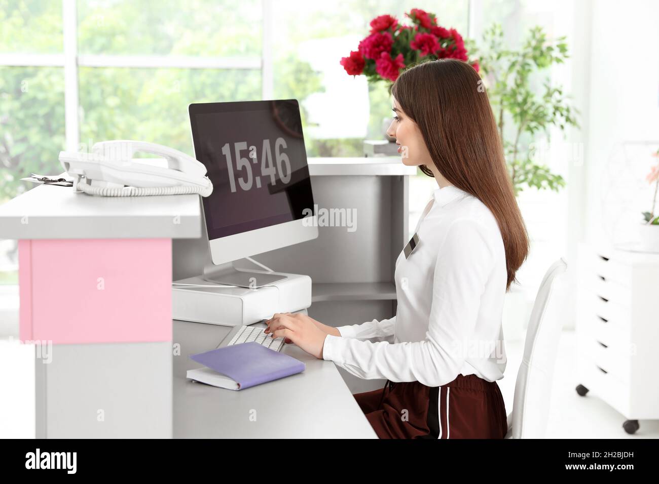 Salon receptionist computer hi-res stock photography and images - Alamy