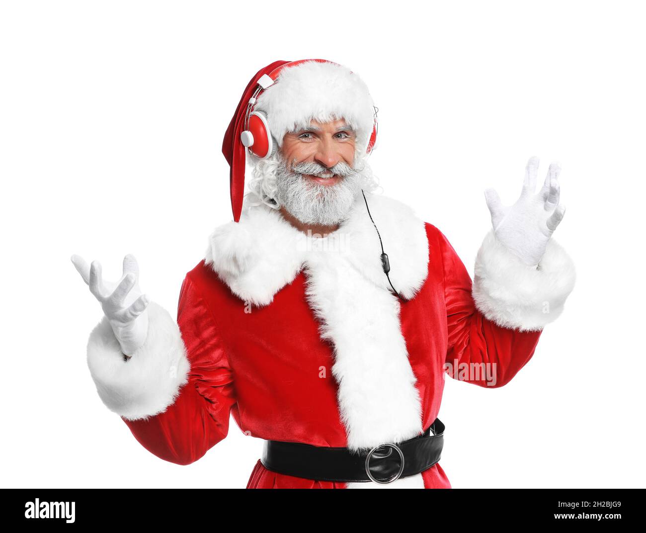 Santa Claus listening to Christmas music on white background Stock ...