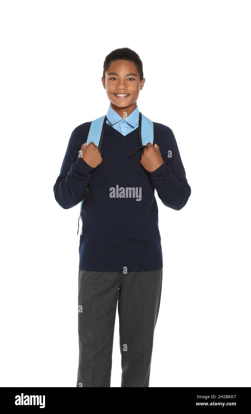 African American teenage boy in stylish school uniform on white ...