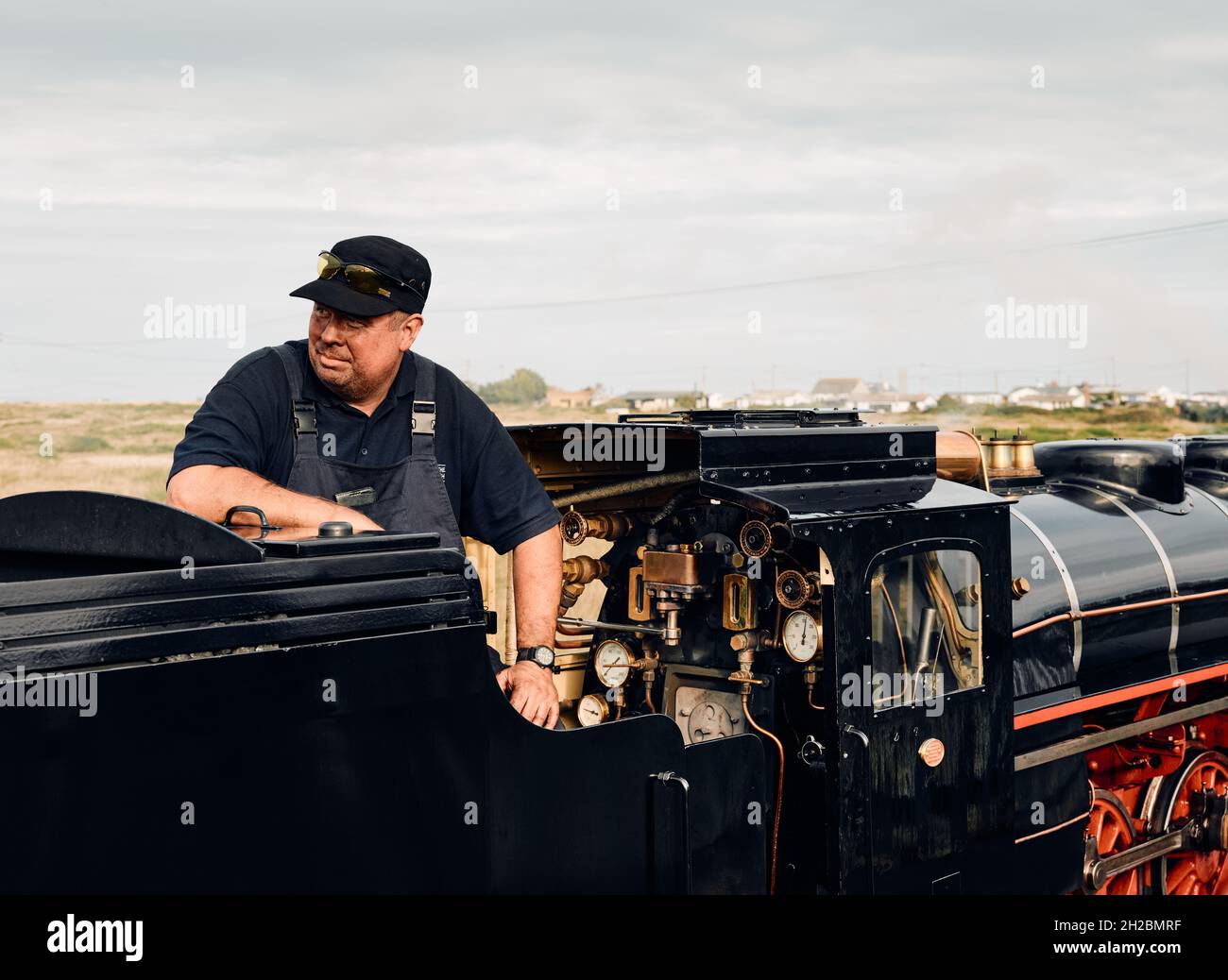 A steam engine driver and Black Prince locomotive on the narrow gauge ...