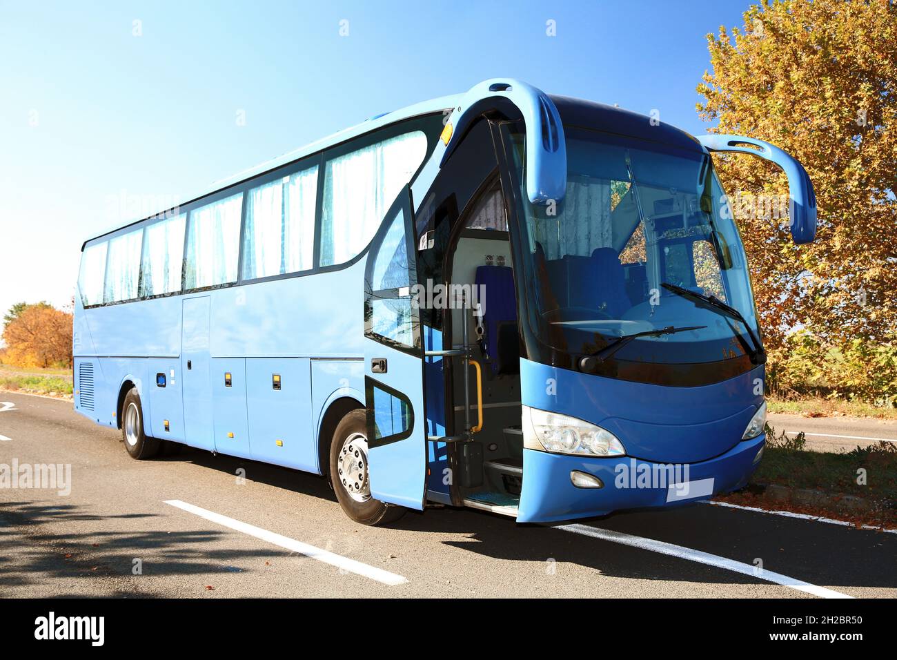 Modern blue bus on road. Passenger transportation Stock Photo - Alamy