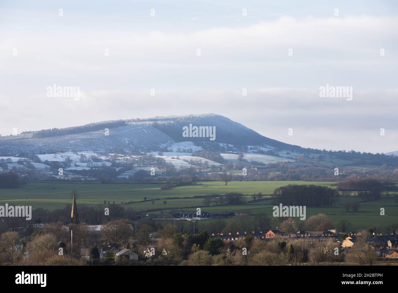 Snowy mountain covered in fresh winter snow. View of Pendle hill in the ...