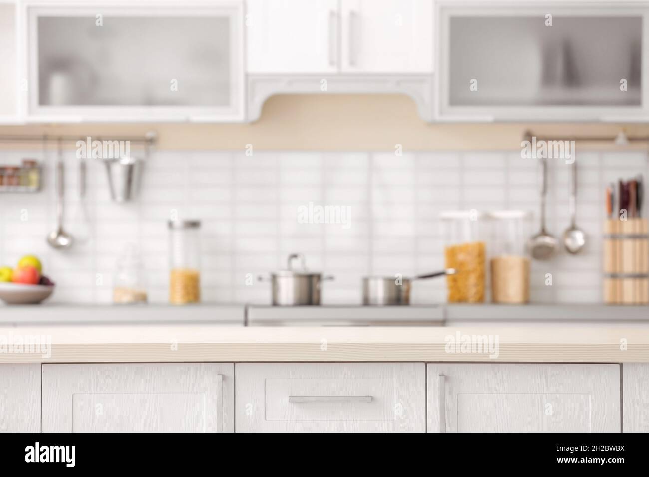 Countertop and blurred view of kitchen interior on background Stock ...