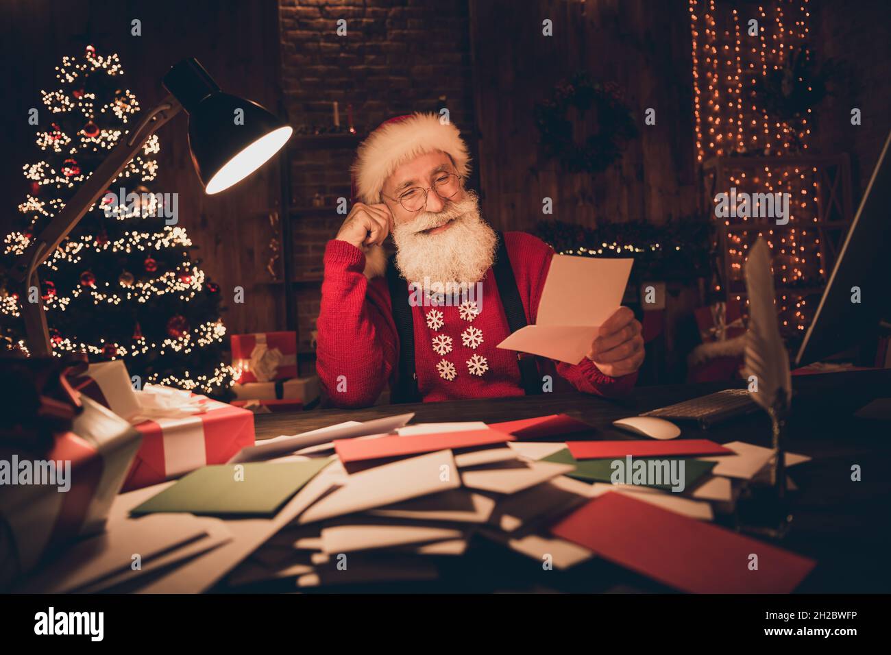 Photo of aged santa claus happy positive smile laugh read letters ...