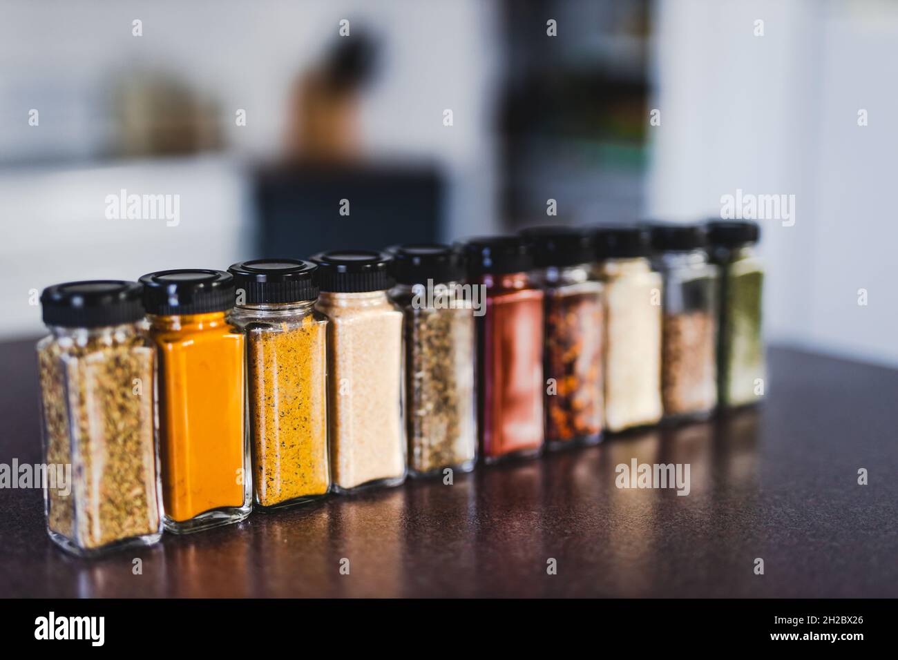 spices seeds and seasonings in matching spice jars on tidy pantry shelf ...
