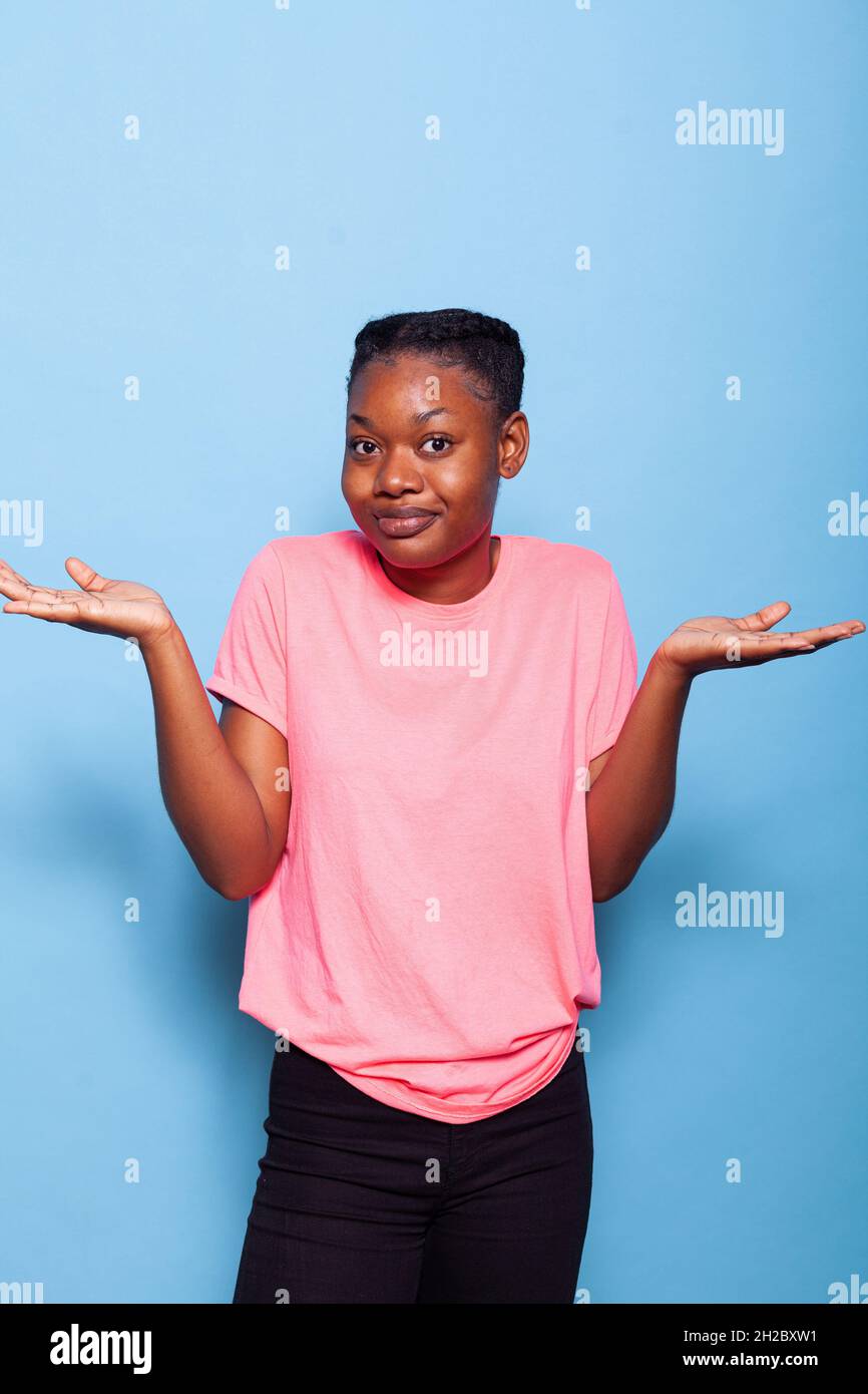 Portrait young woman who shrugging hi-res stock photography and images ...
