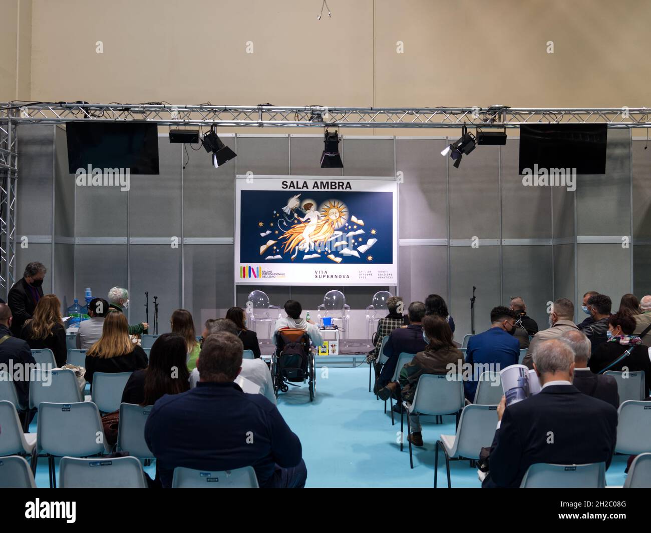 Turin book fair, meeting room: visitors to the fair attend a book ...