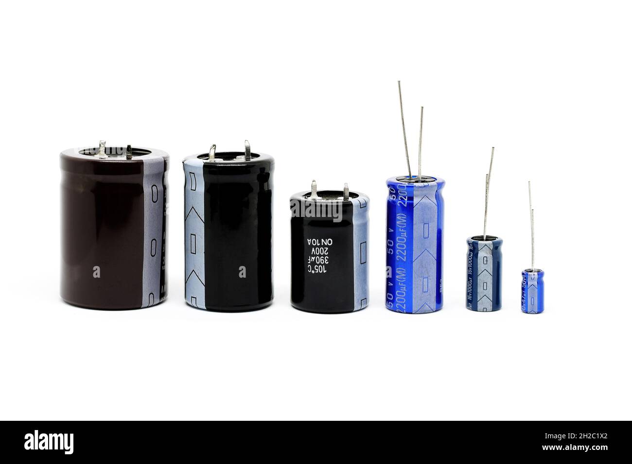 Group of capacitors different sizes isolated on white background Stock Photo - Alamy