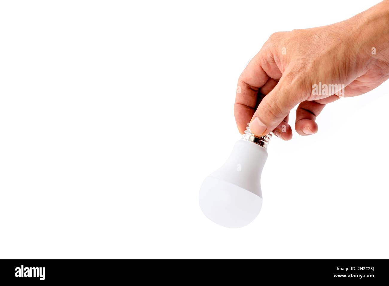 Human hand holding LED light bulb isolated on white background Stock ...