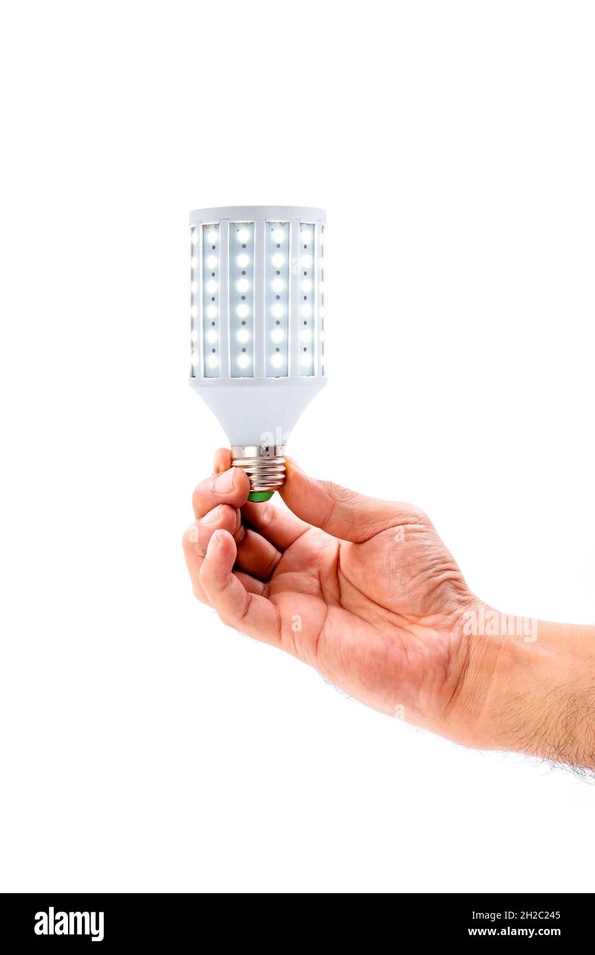 Human hand holding LED light bulb isolated on white background Stock ...