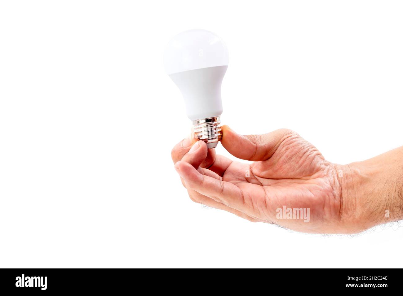Human hand holding LED light bulb isolated on white background Stock ...