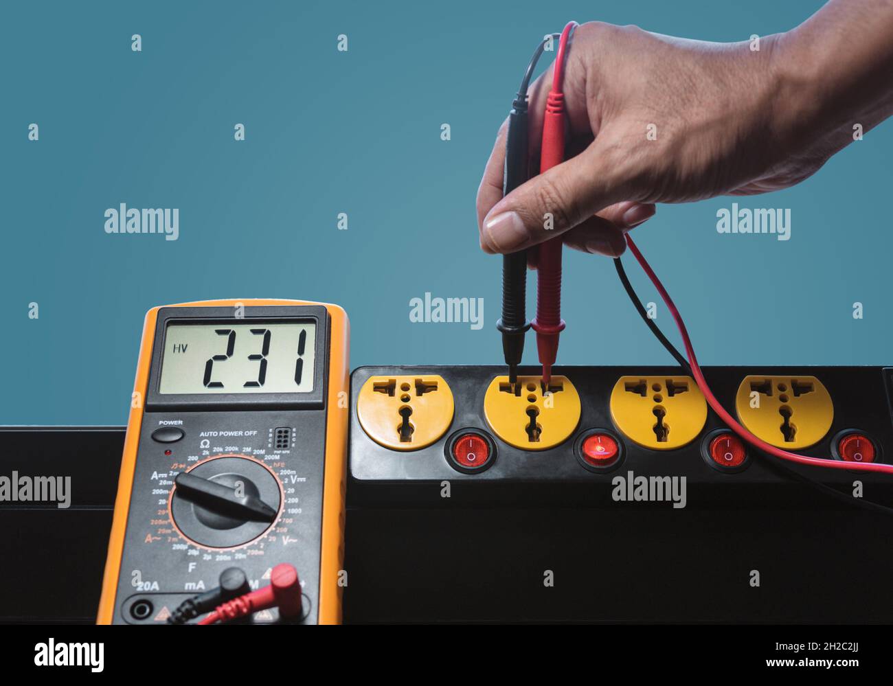 Measure the AC voltage of 230 Volts from the power outlet with a ...