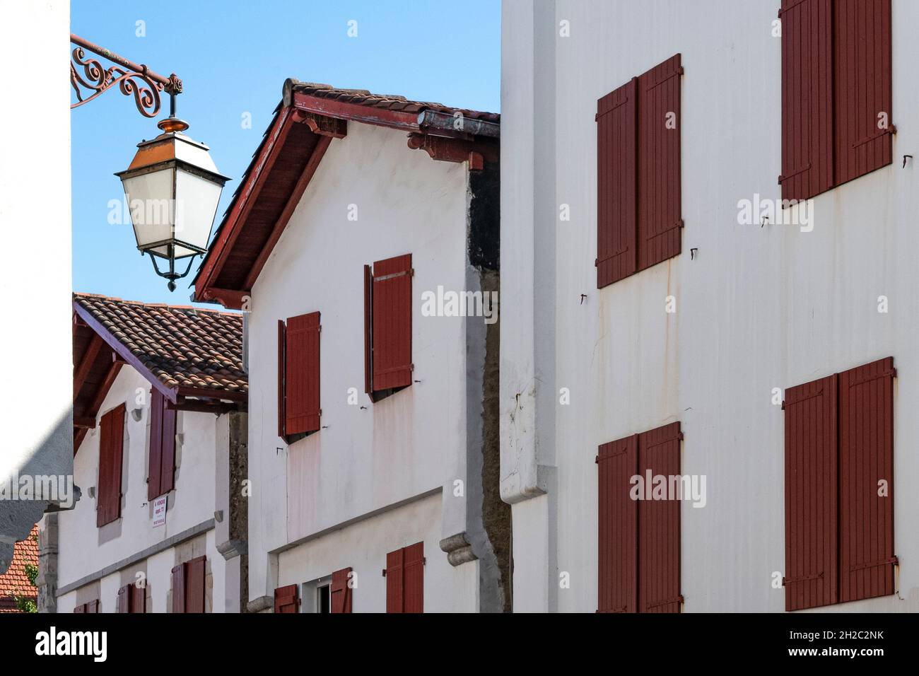 Traditional basque houses at the Rue Pocalette in the old town of ...