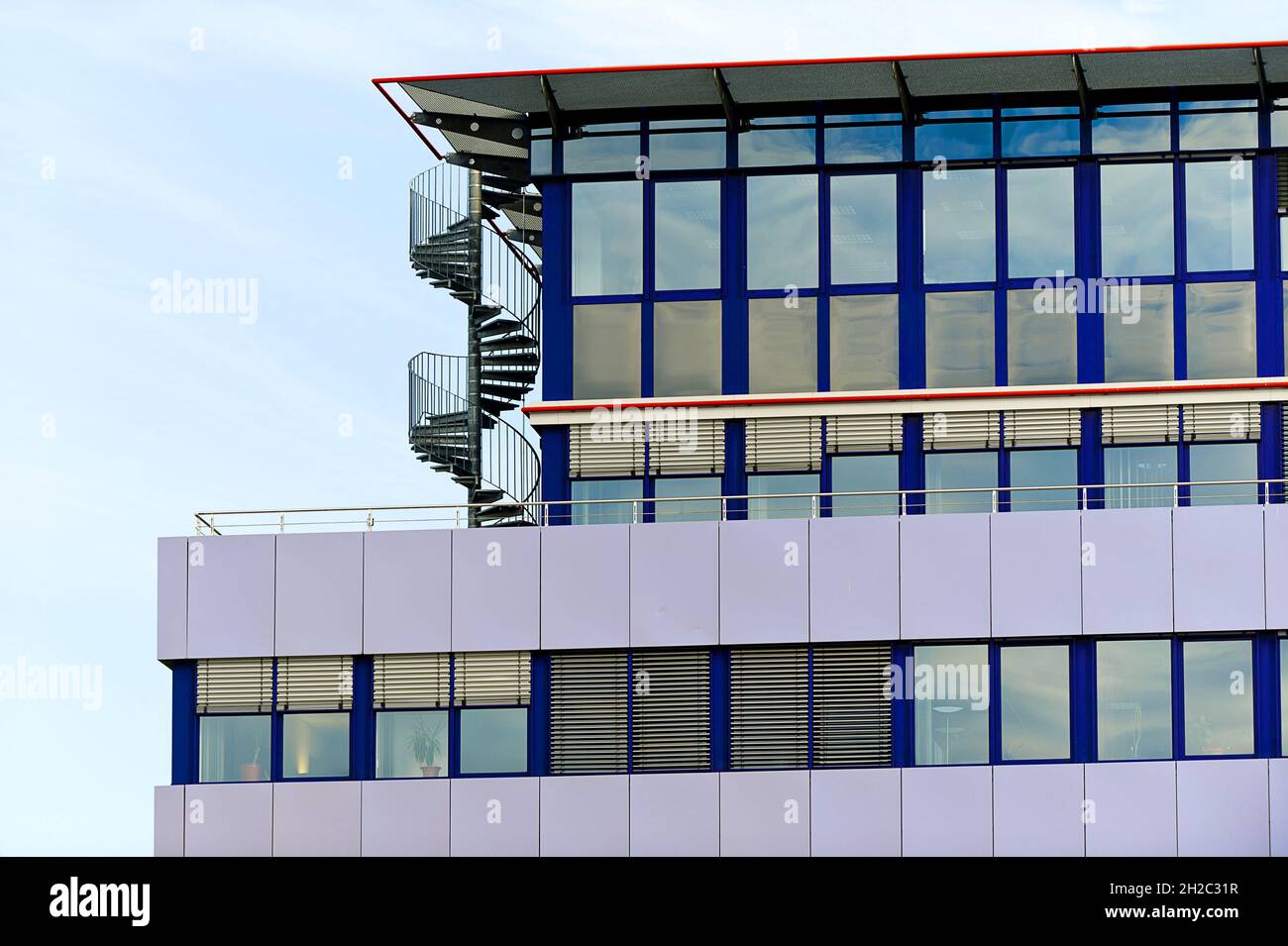 glass facade of an office building with fire escape, Germany Stock ...