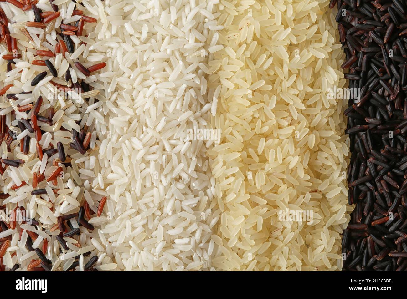Brown and other types of rice as background, closeup Stock Photo - Alamy
