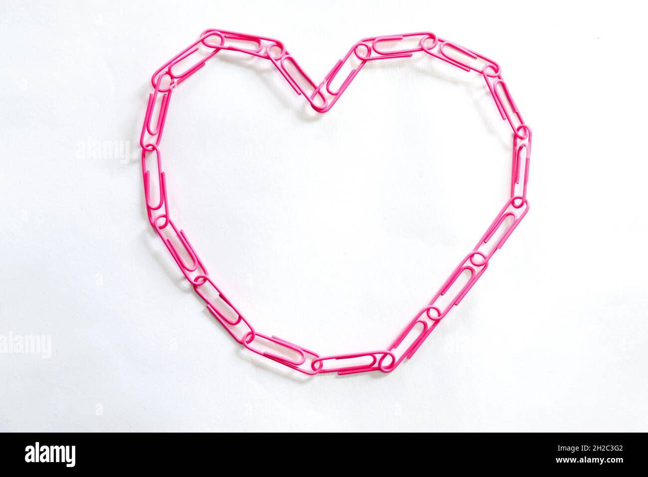 Group of paperclip on white background Stock Photo - Alamy