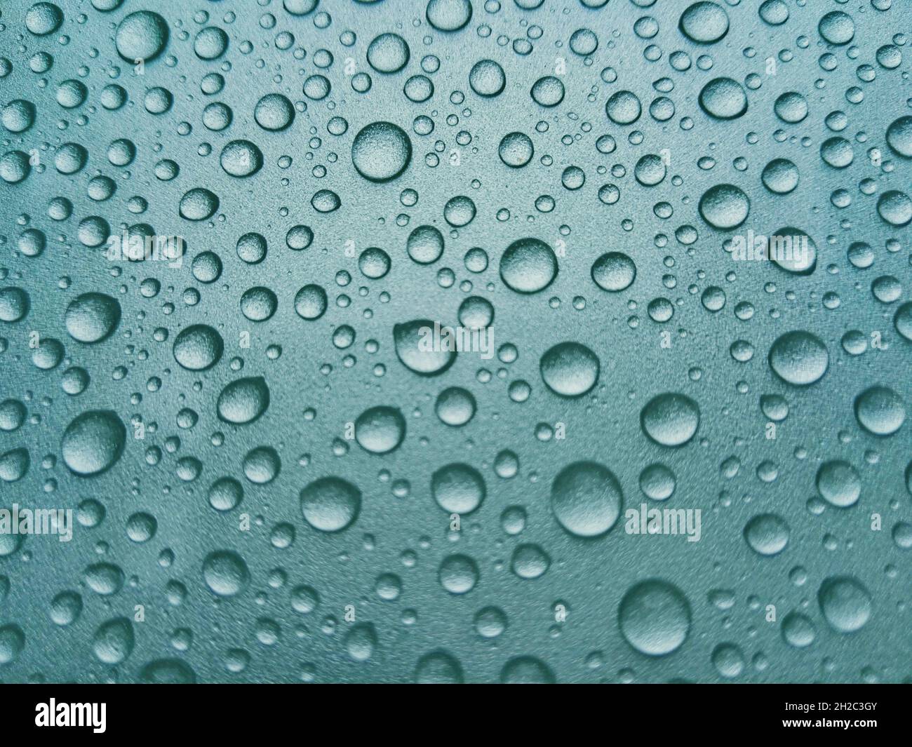 Beautiful rain dew on the top of the car Stock Photo - Alamy