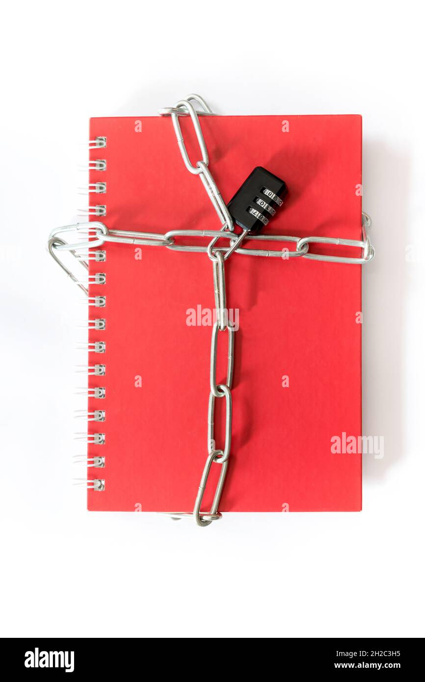 Note Book red lock with a key chain on white background Stock Photo - Alamy