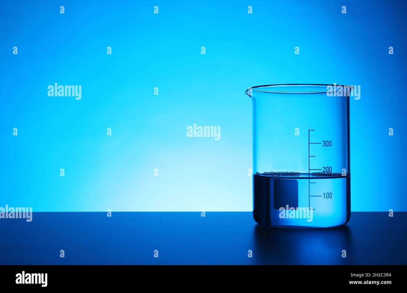 Empty beaker on table against color background. Chemistry laboratory ...