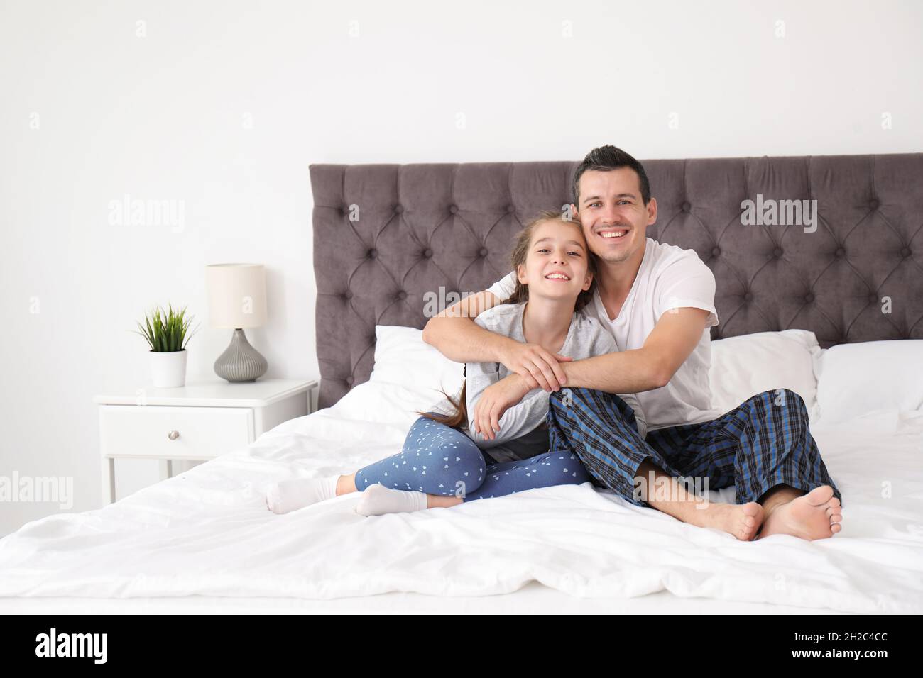 Father with his cute child in bedroom. Happy family Stock Photo - Alamy