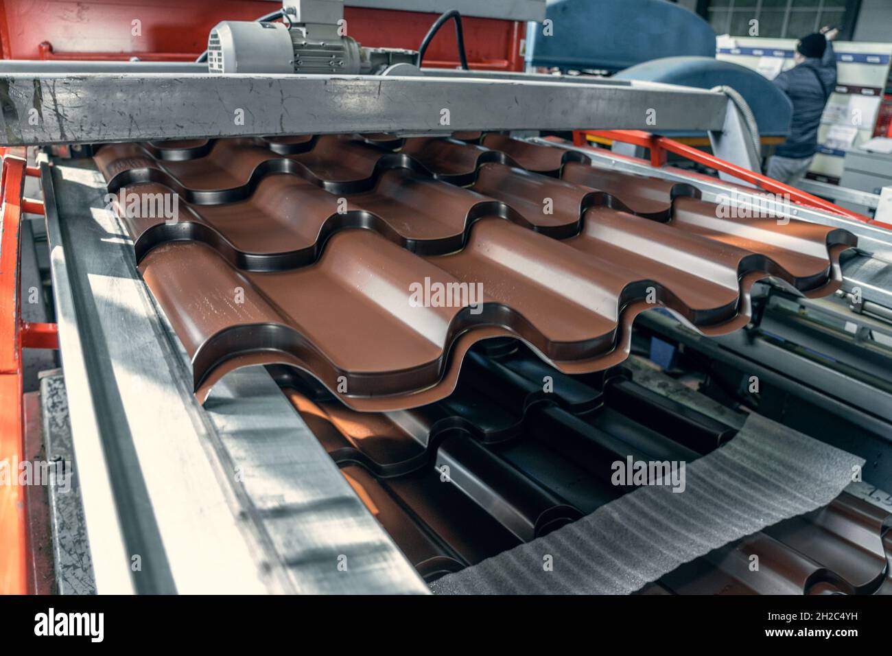 Production line of metal tile for roof. Conveyor belt at metalworking ...