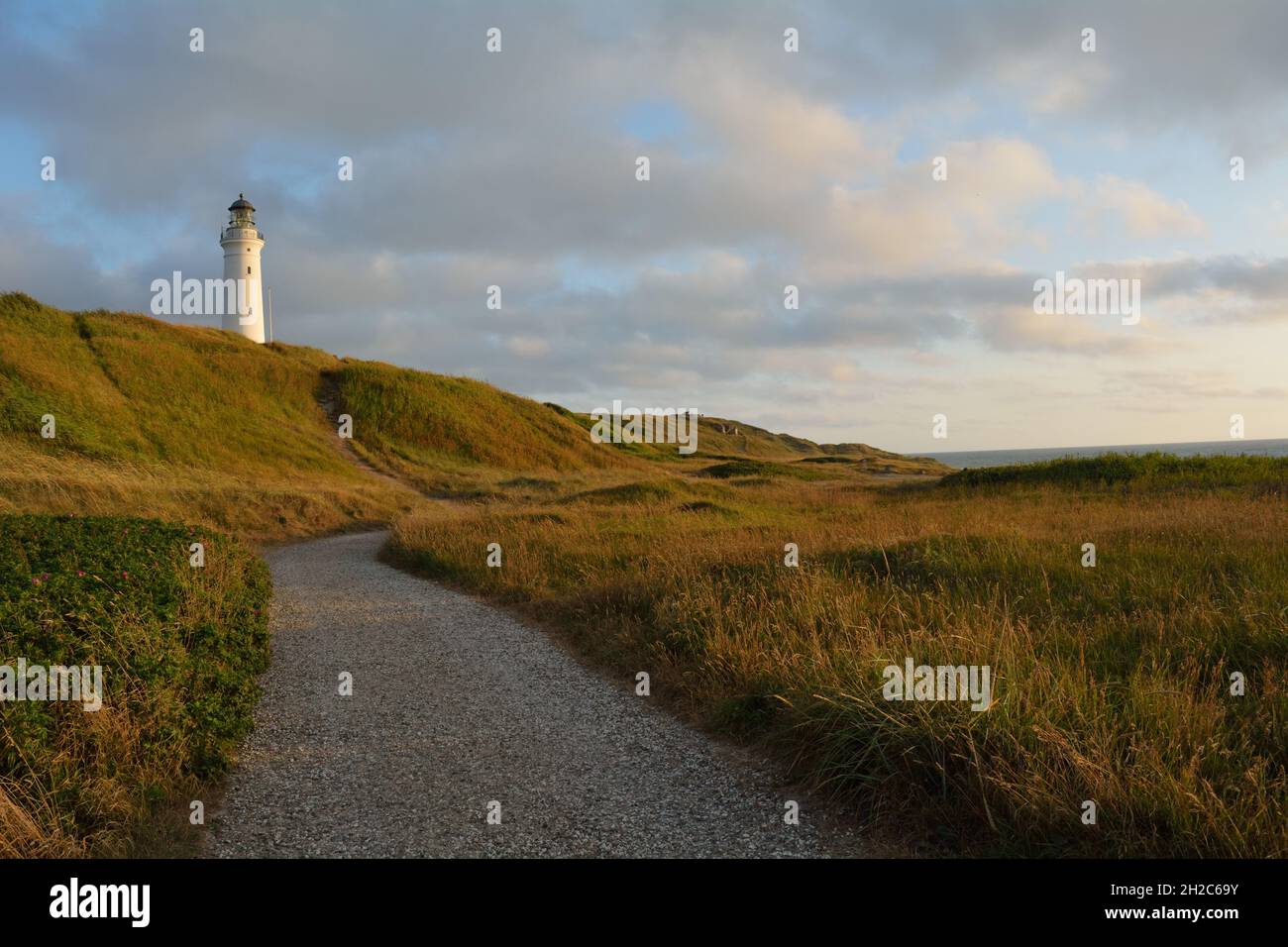 Romantic lighthouse immersed in the colors of the golden hour Stock ...