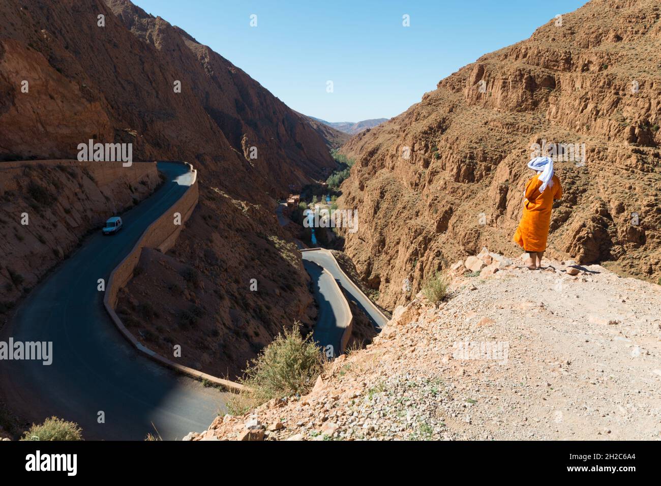 A man in traditional clothing in the Dades Gorge in Morocco Stock Photo ...
