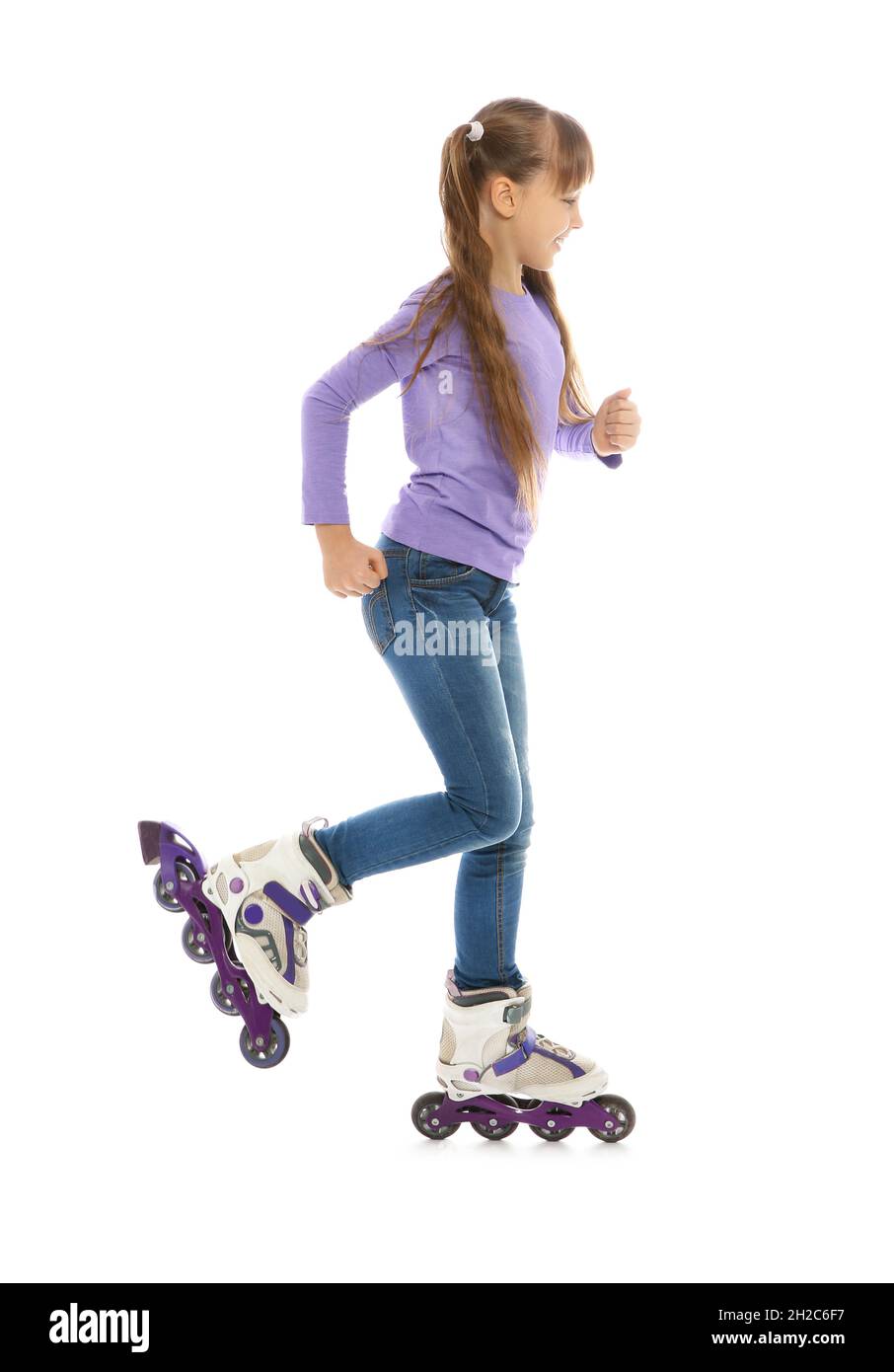 Little girl with inline roller skates on white background Stock Photo ...
