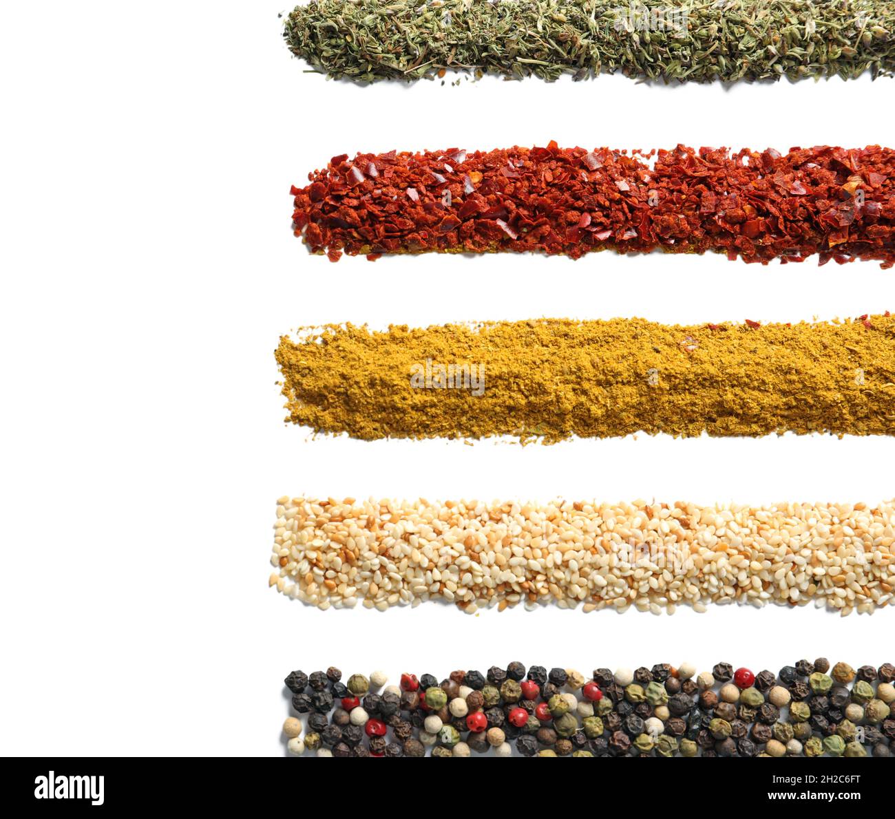 Rows of different aromatic spices on white background, top view with ...