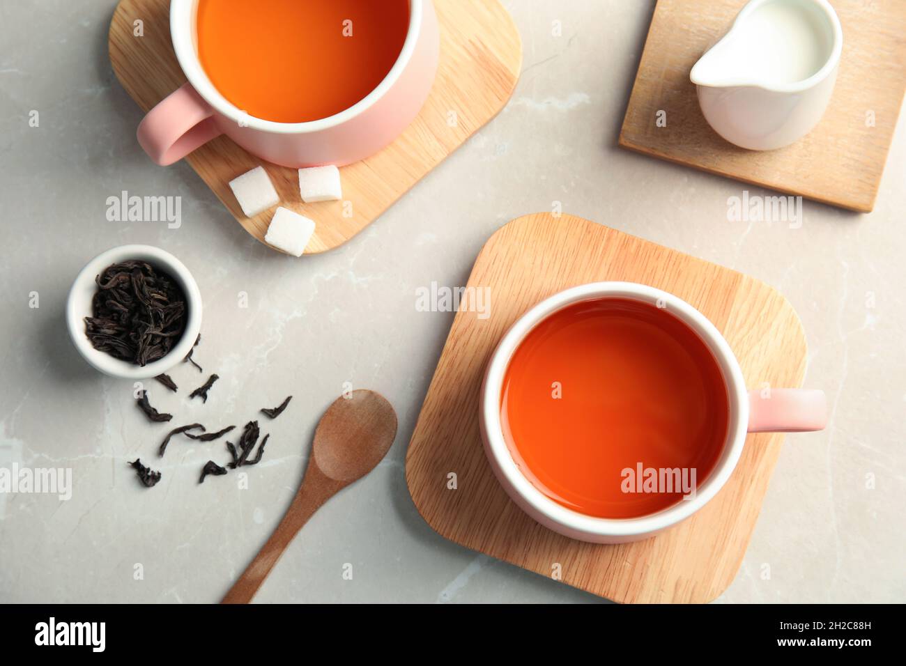Flat lay composition with cups of black tea on table, top view Stock ...