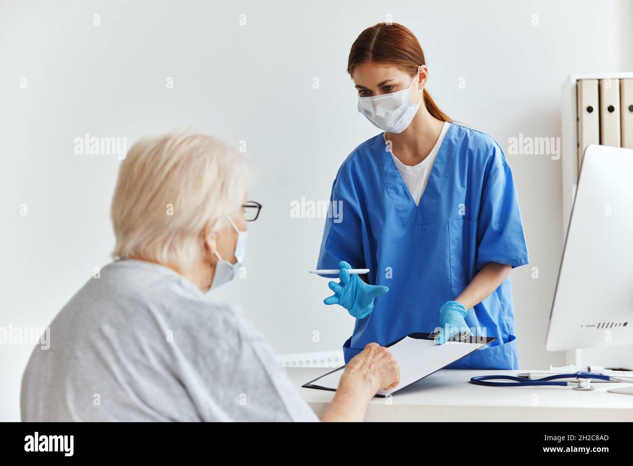 nurse and patient examination medical masks Stock Photo - Alamy